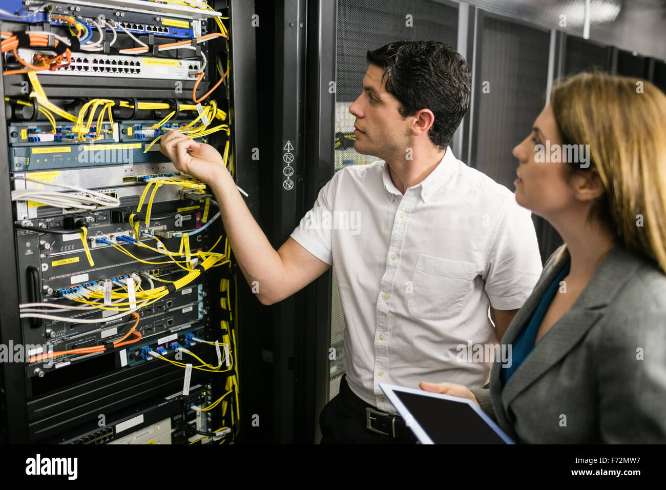 Team of technicians working together Stock Photo - Alamy