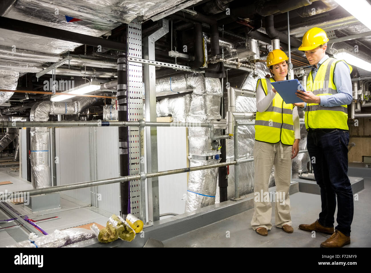 Engineers checking the temperature pipes Stock Photo - Alamy