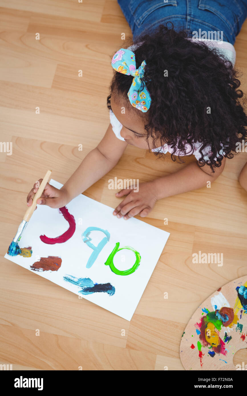 Child painting letters Stock Photo - Alamy