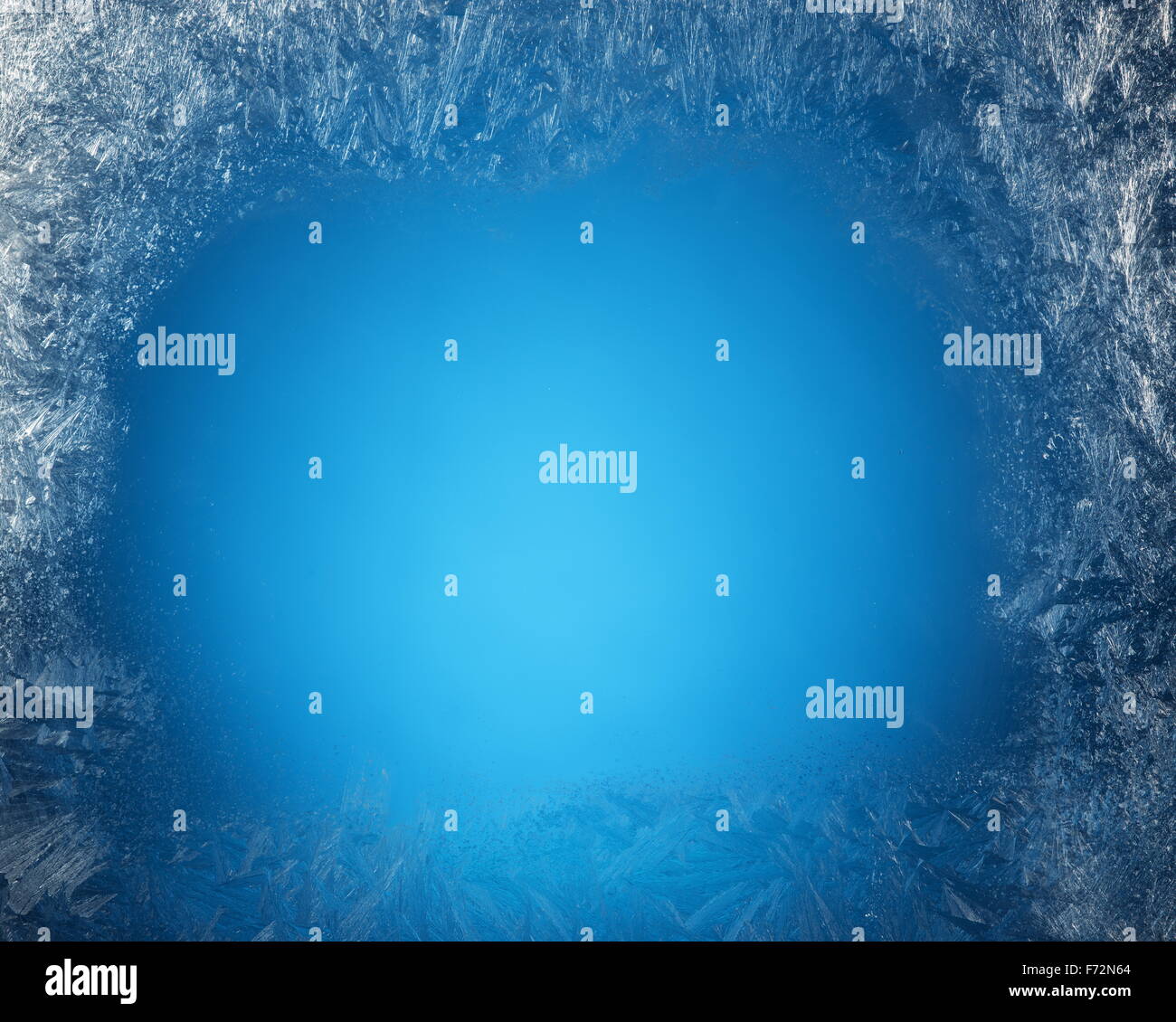 Frosty patterns on the edge of a frozen window Stock Photo - Alamy