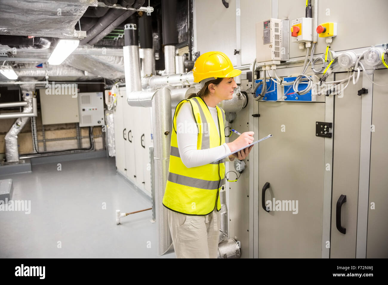 Engineer checking the temperature pipes Stock Photo - Alamy