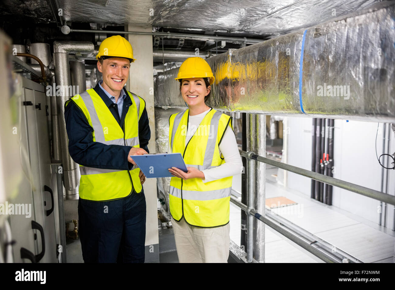 Engineers working in temperature control room Stock Photo - Alamy