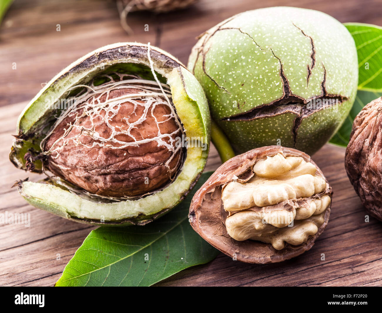 Walnut and walnut kernel on the wooden table Stock Photo - Alamy