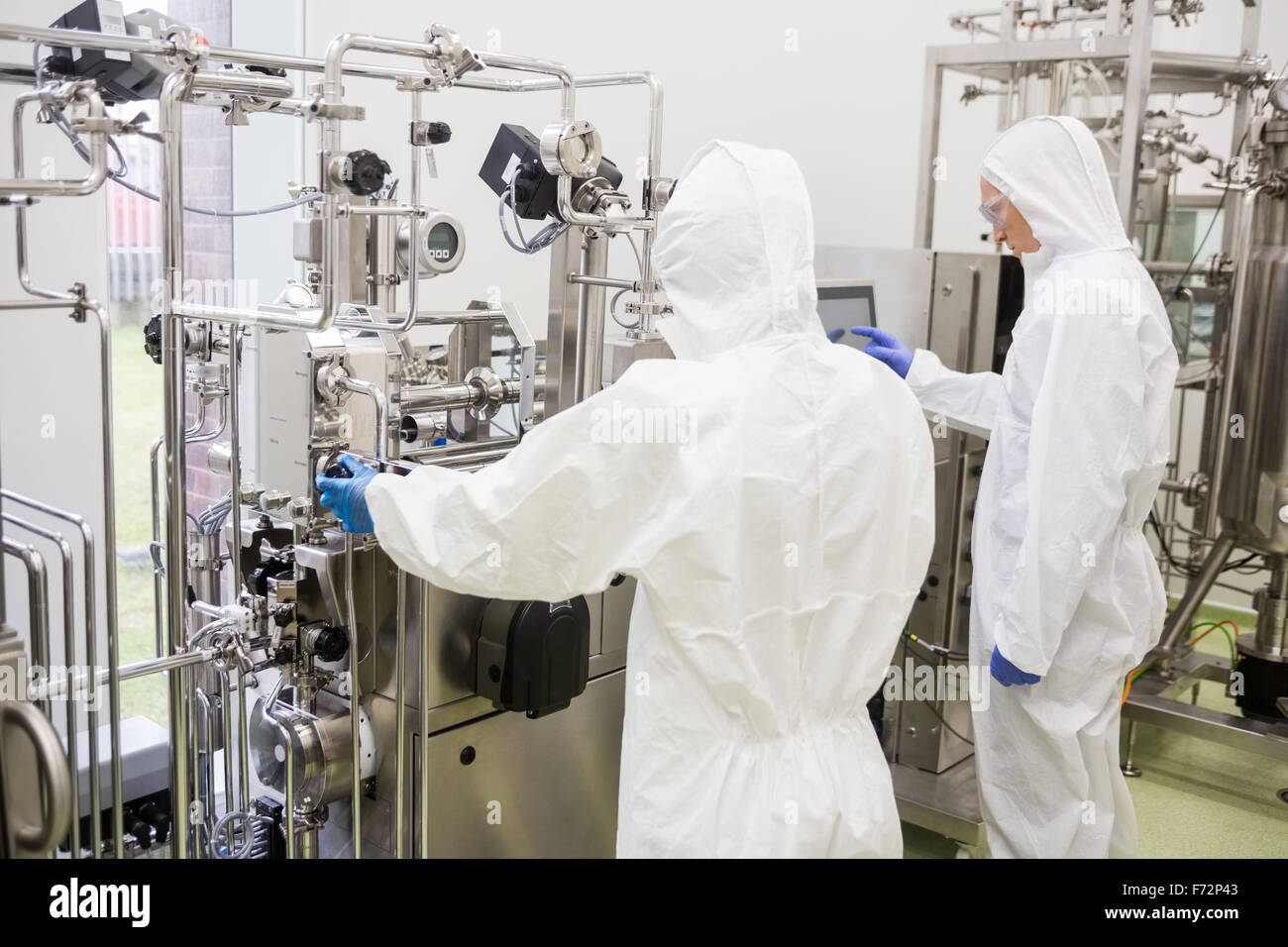 Scientist using screen to control vats Stock Photo - Alamy