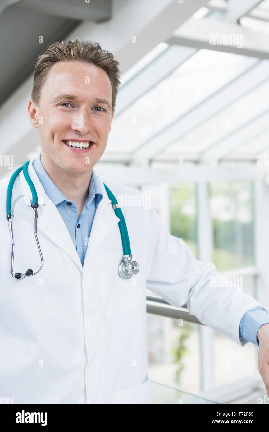 Young doctor smiling at camera Stock Photo - Alamy
