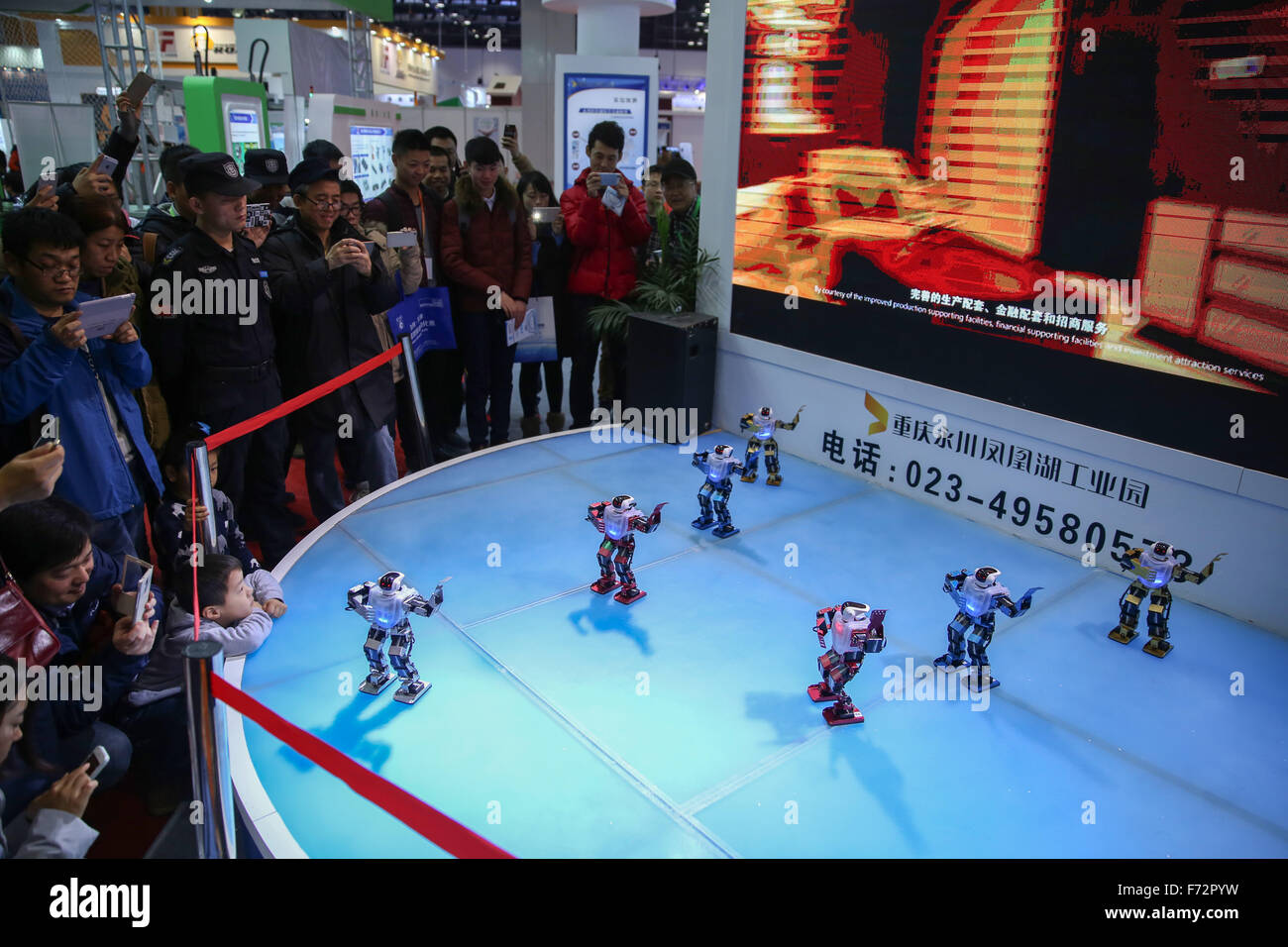 Beijing, China. 24th Nov, 2015. Visitors are attracted by dancing ...