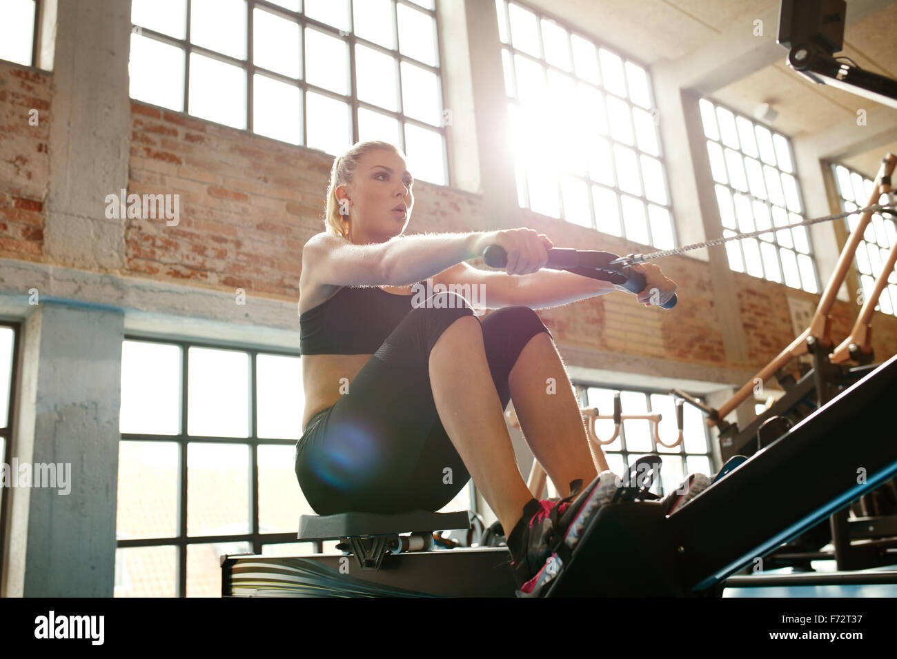 Caucasian female doing exercise routine High Resolution Stock ...