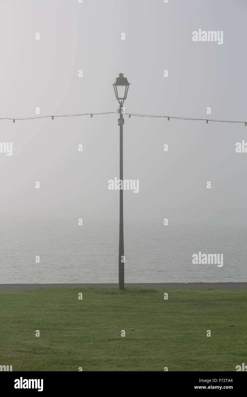 Old lamp posts in mist hi-res stock photography and images - Alamy