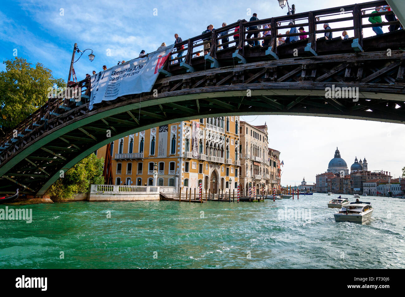 Accademia Bridge in Venice, Italy. People on the bridge crossing Grand ...