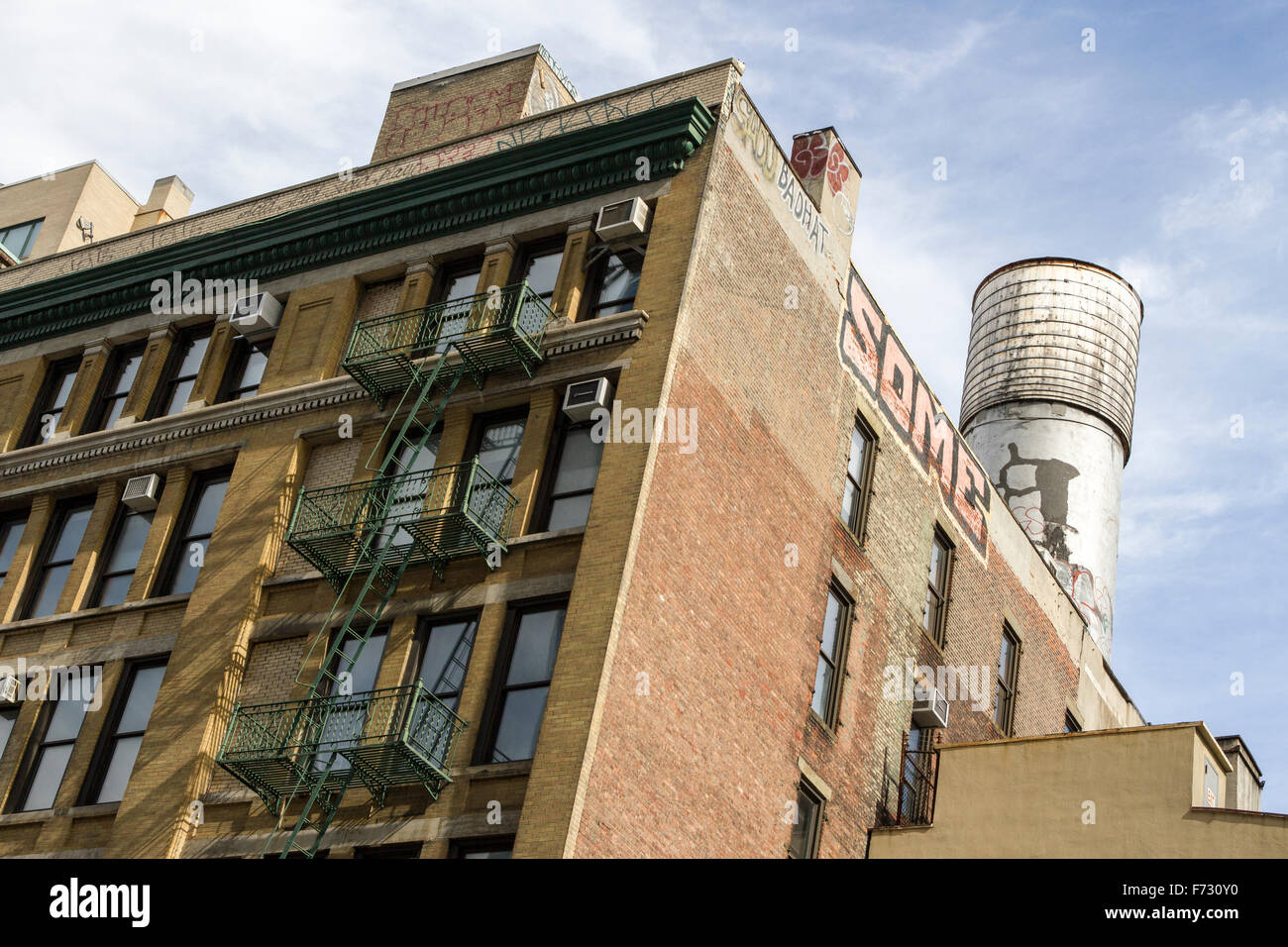 Soho loft buildings with fire escape and water towers Stock Photo - Alamy