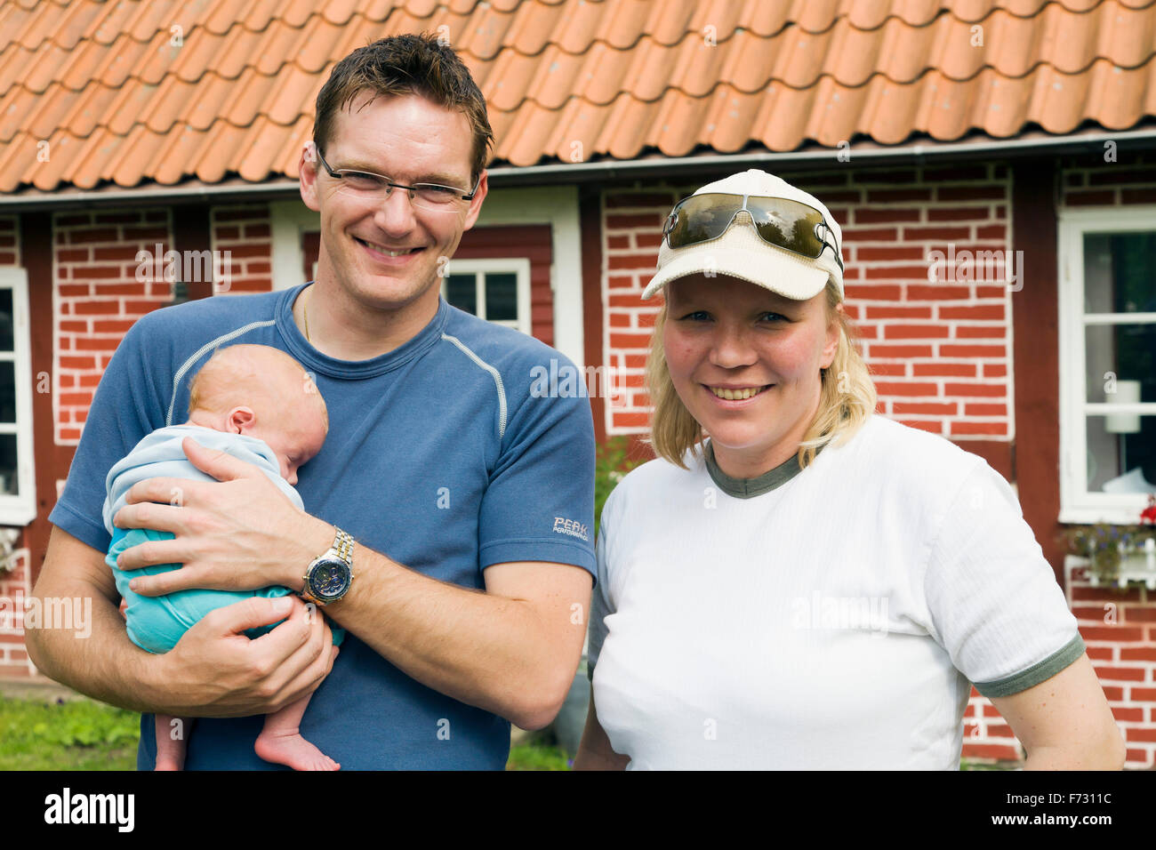 Proud parents man woman infant hi-res stock photography and images - Alamy