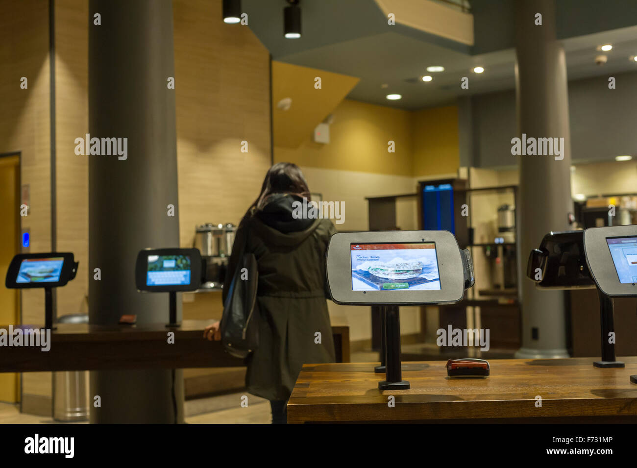 Ordering kiosks, replacing cashiers, at a Panera Bread cafe in New York ...