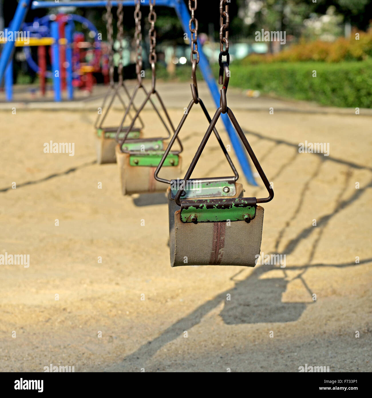 empty old chain swings in kids playground Stock Photo - Alamy