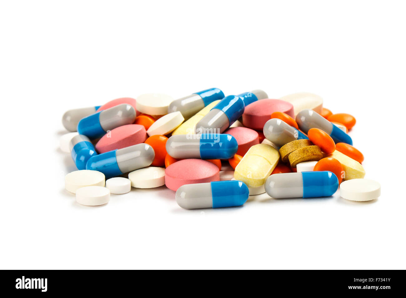 multicolored pills on white background Stock Photo - Alamy