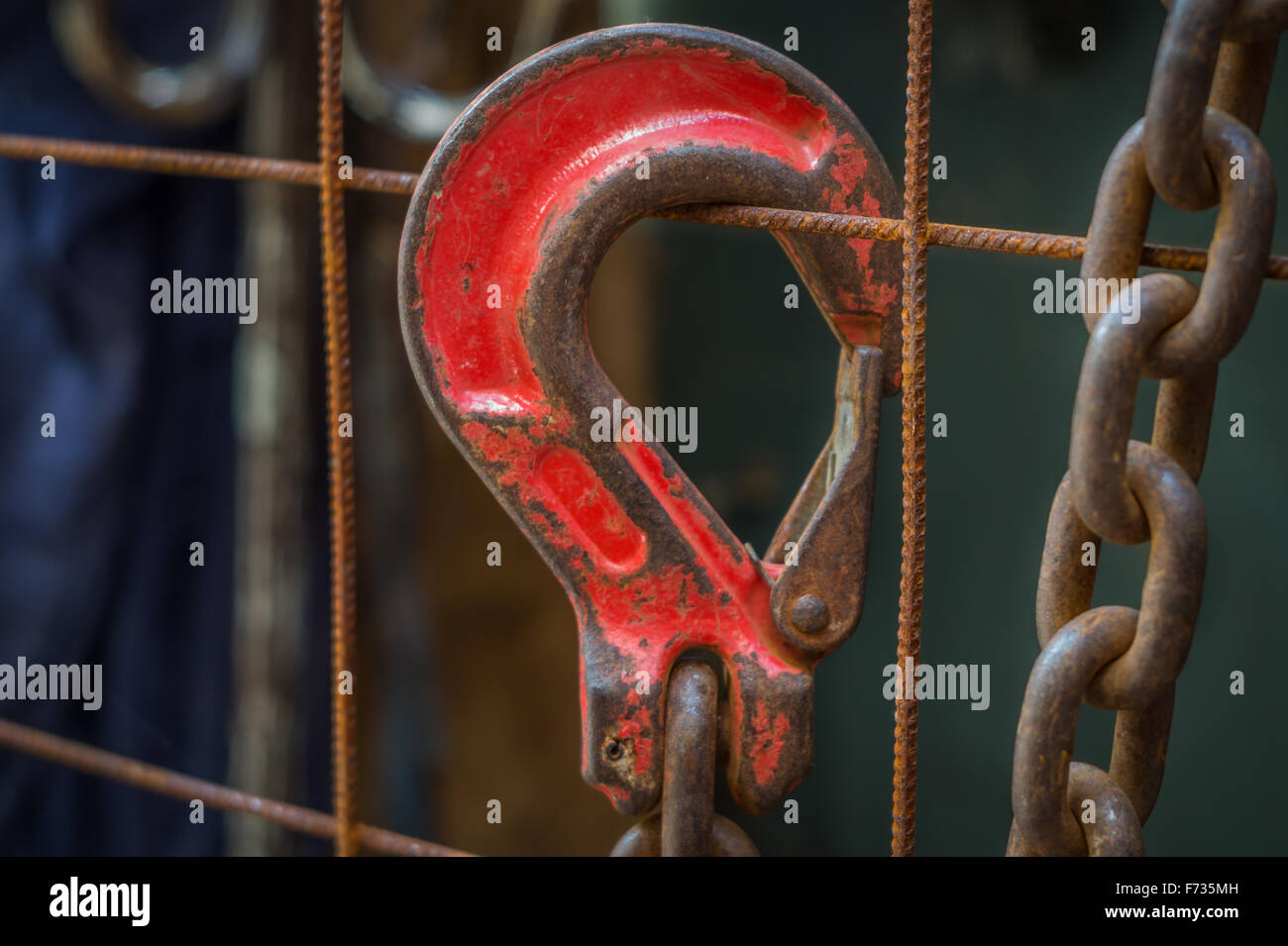 Hook with a chain is attached to the metal rods Stock Photo - Alamy