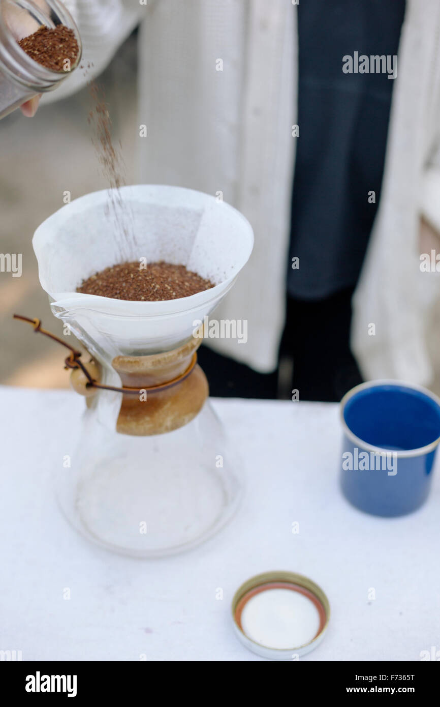 High angle view of a glass coffee maker, a conical jar with filter ...