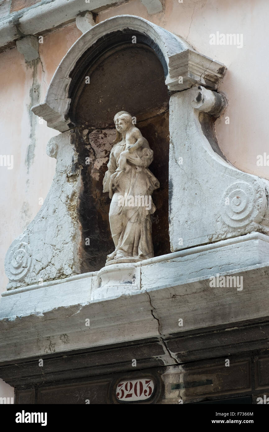 Small religious shrine above doorway, Venice, Italy Stock Photo - Alamy