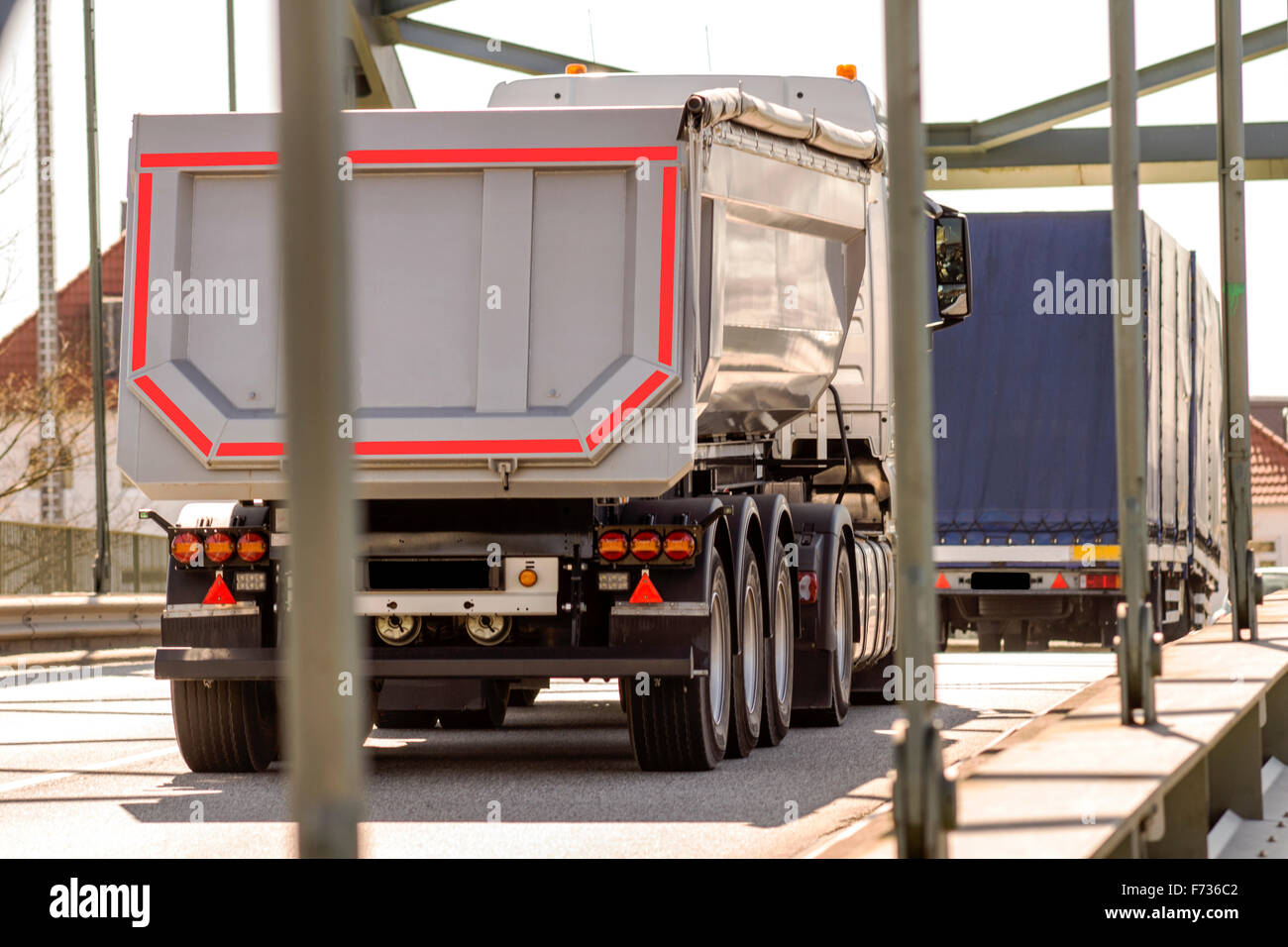 Container truck driving over bridge Stock Photo - Alamy