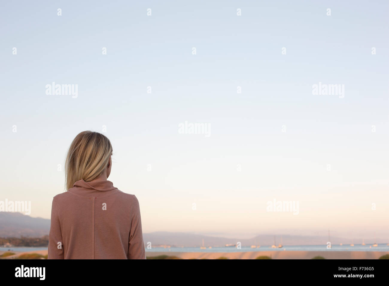 Woman standing water ocean hi-res stock photography and images - Alamy