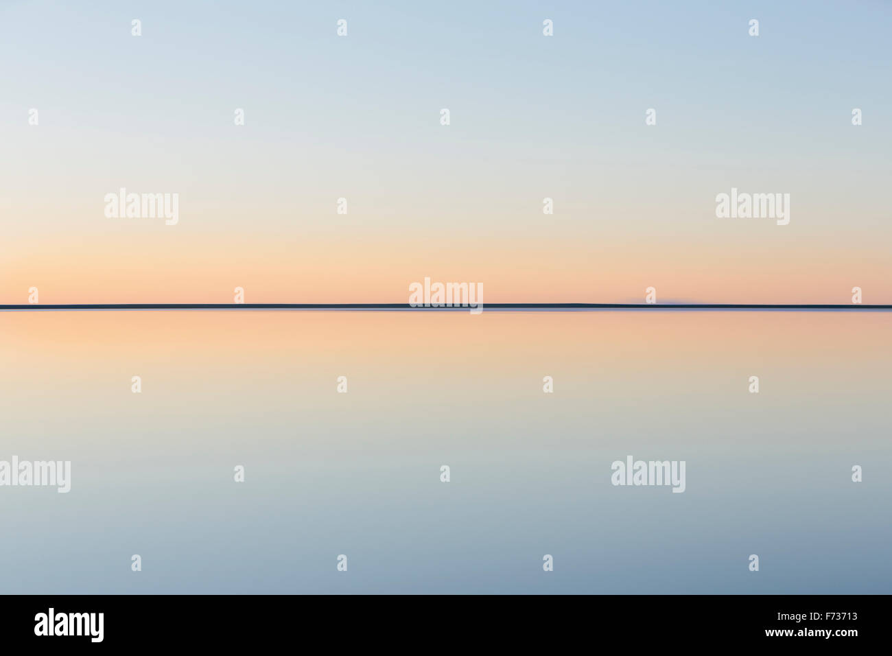 The view to the clear line of the horizon where land meets sky, across ...