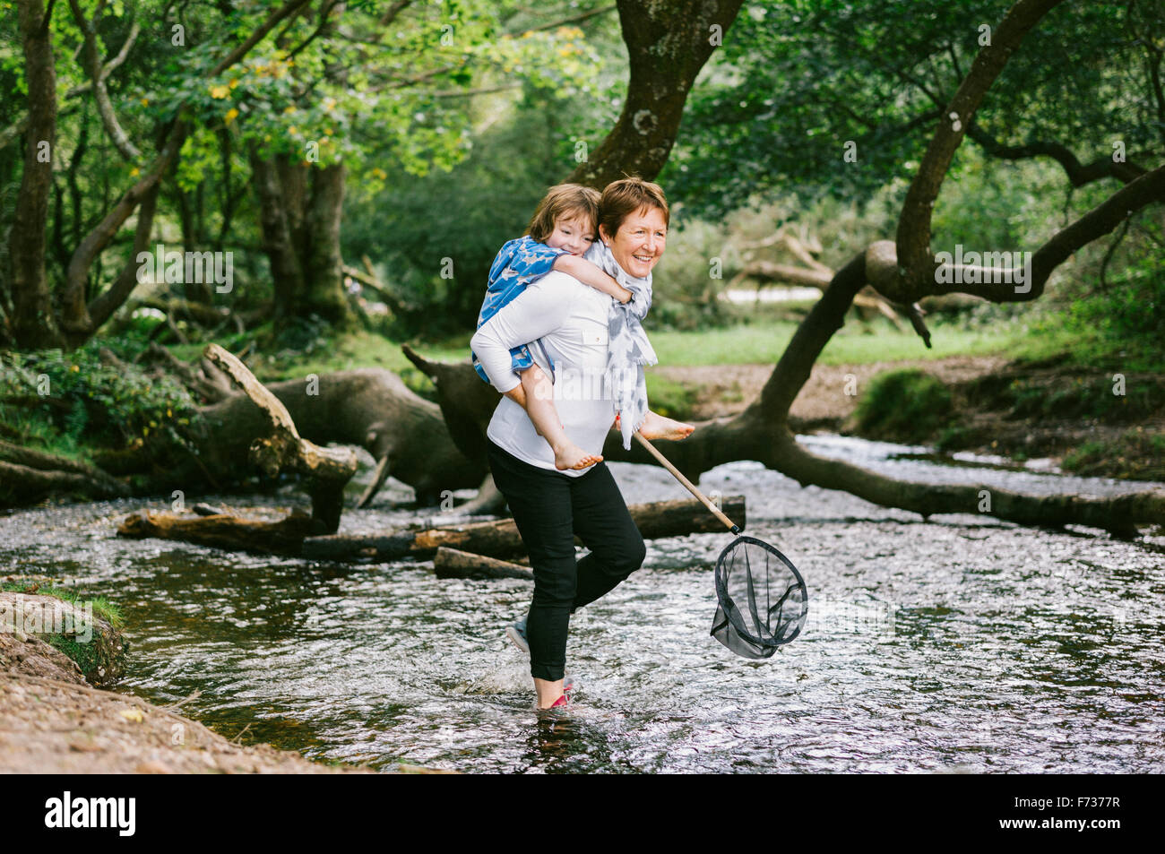 Woman wading in river hi-res stock photography and images - Alamy
