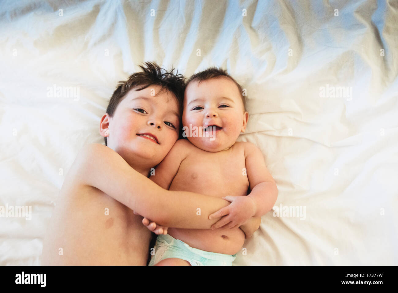 Brother sister sibling playing together hi-res stock photography and ...