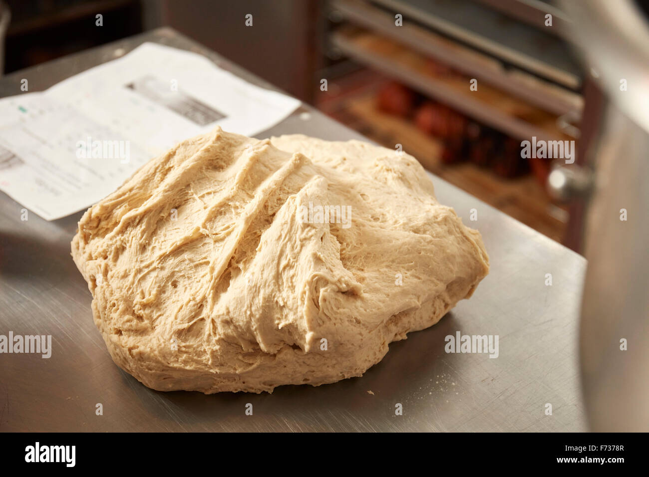 A lump of dough shaped and resting on a work surface Stock Photo - Alamy