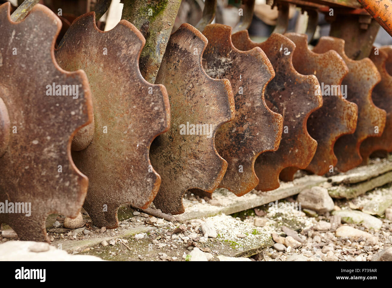 Disks of a harrowing machinery attached to the back of a tractor Stock ...