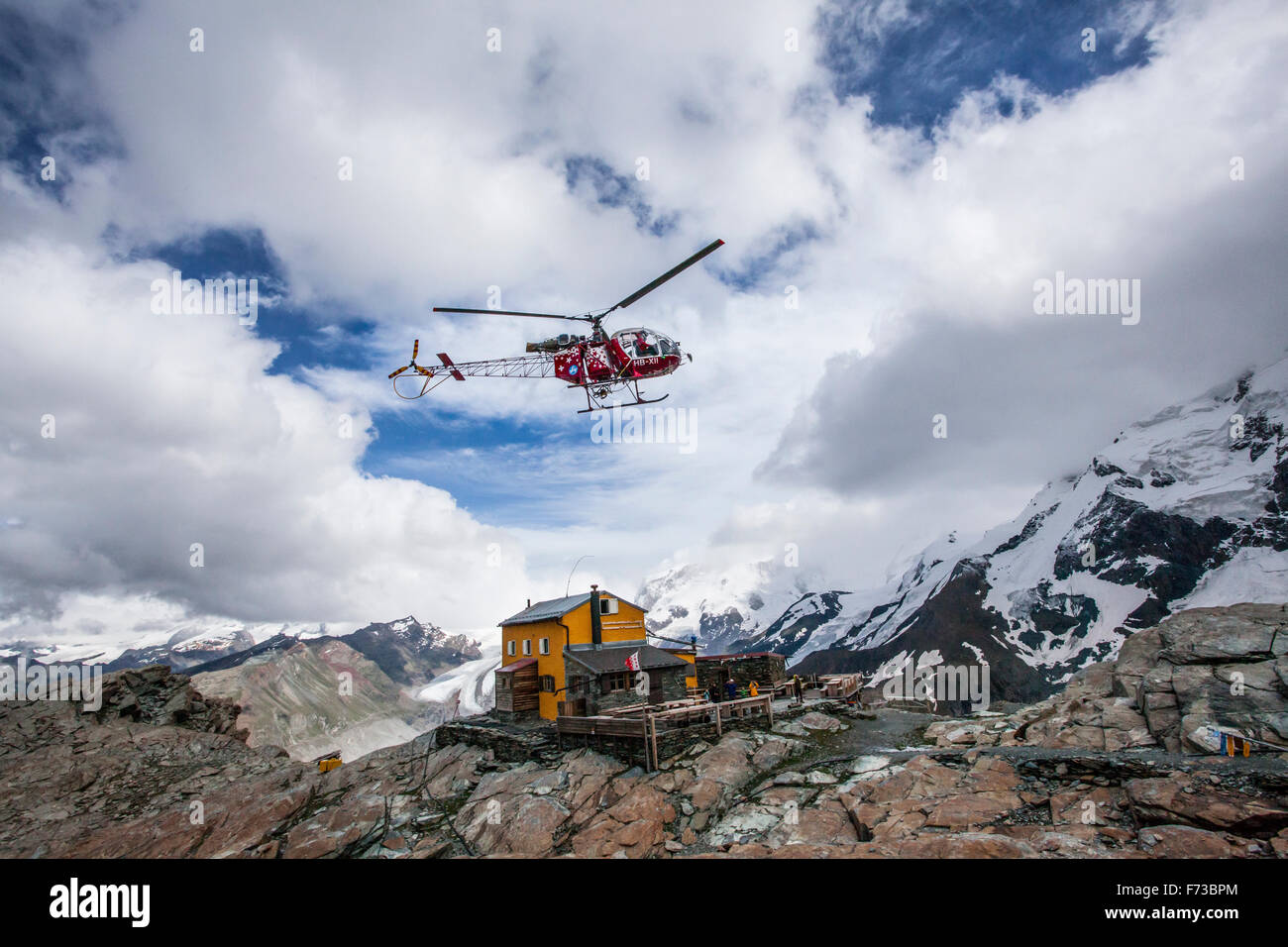 Air Zermatt passing by Gandegghütte and going to a rescue on the ...