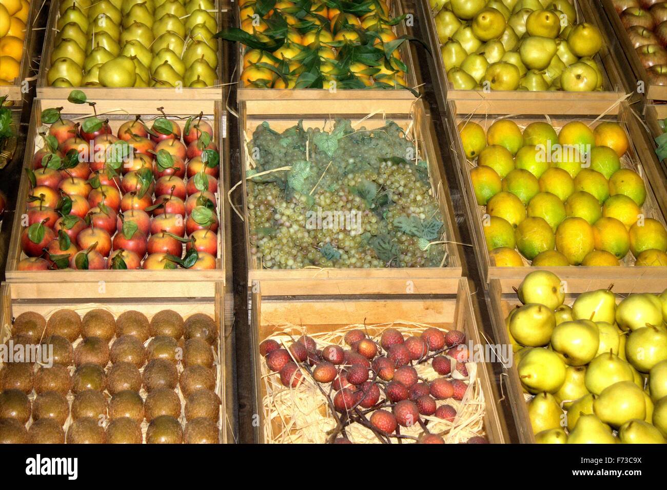 various fruits and vegetables in crates at greengrocer Stock Photo - Alamy