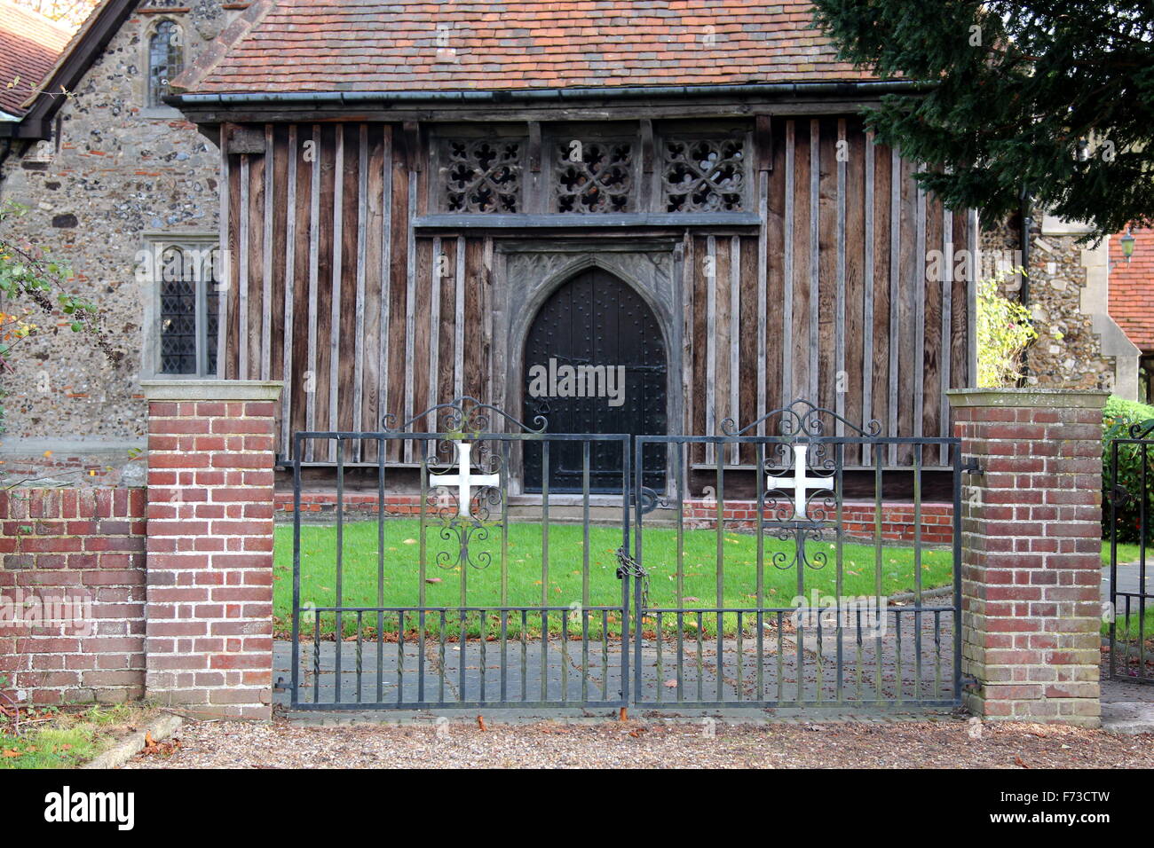 Front gates of All Saints church in Stock village, Essex, UK Stock ...