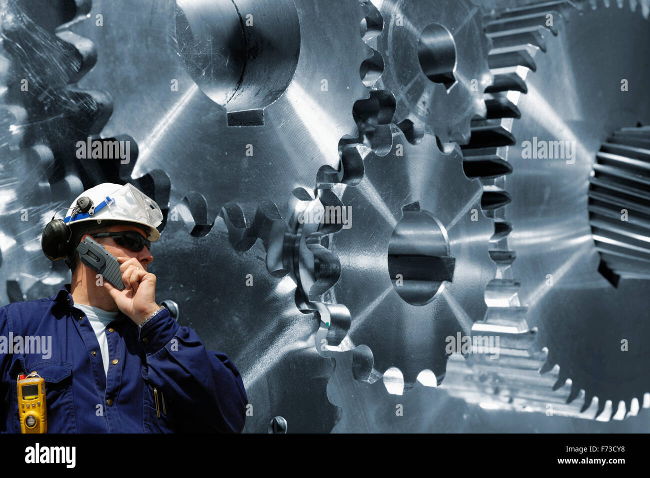 worker, engineer with cogwheels and gears Stock Photo - Alamy