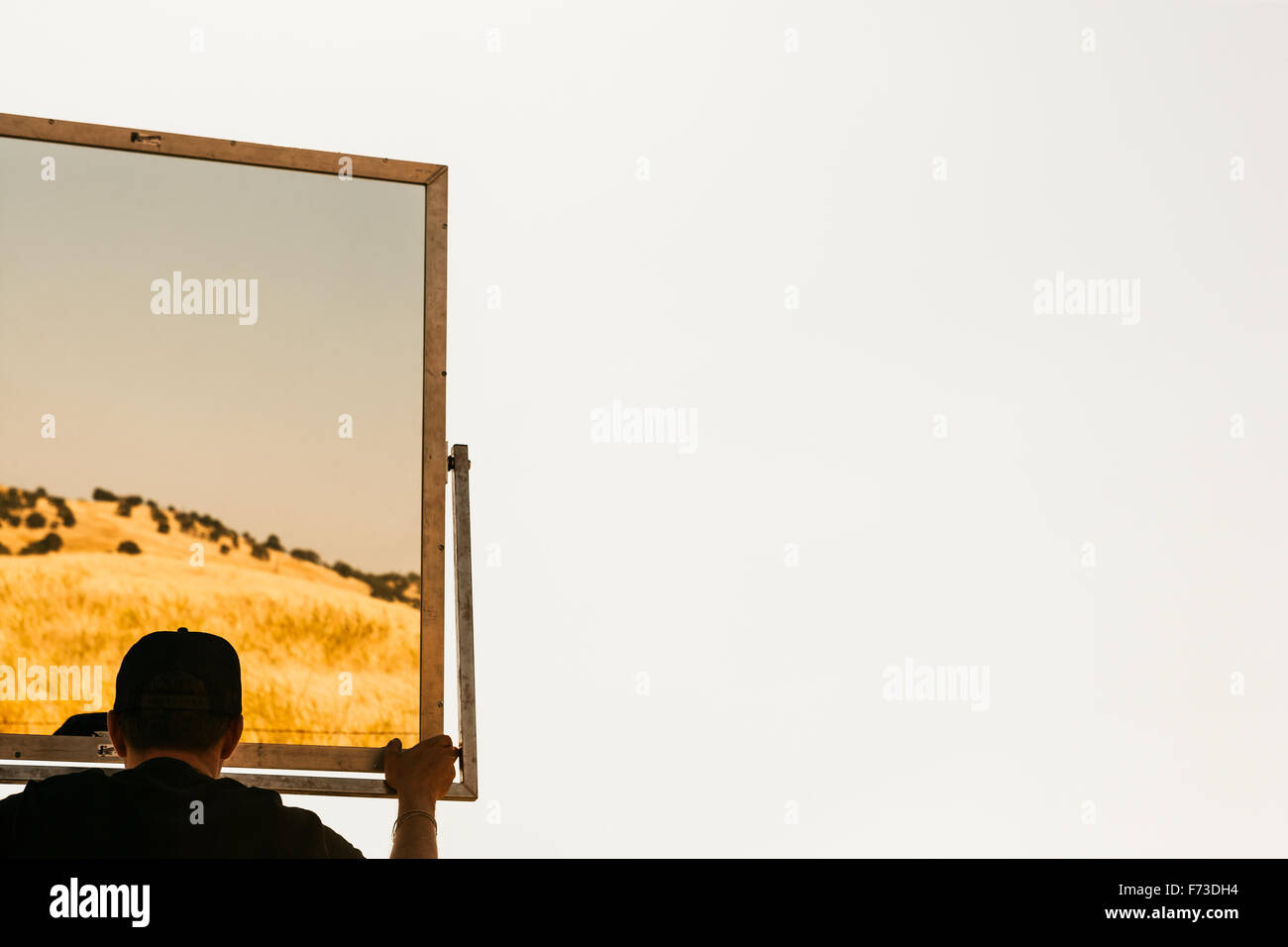 Landscape reflected in mirror Stock Photo - Alamy