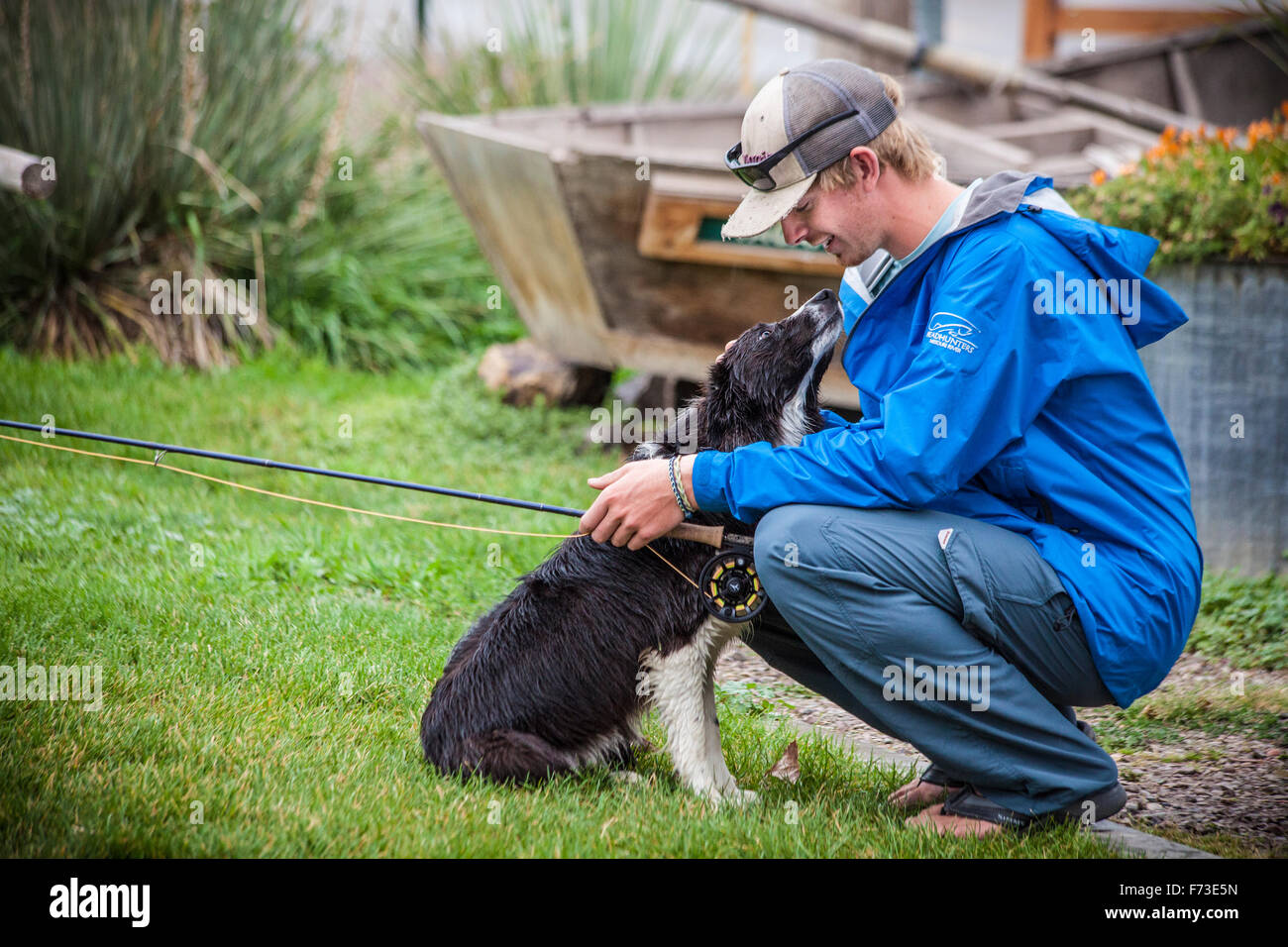 Boy and dog? and fly rod Stock Photo - Alamy