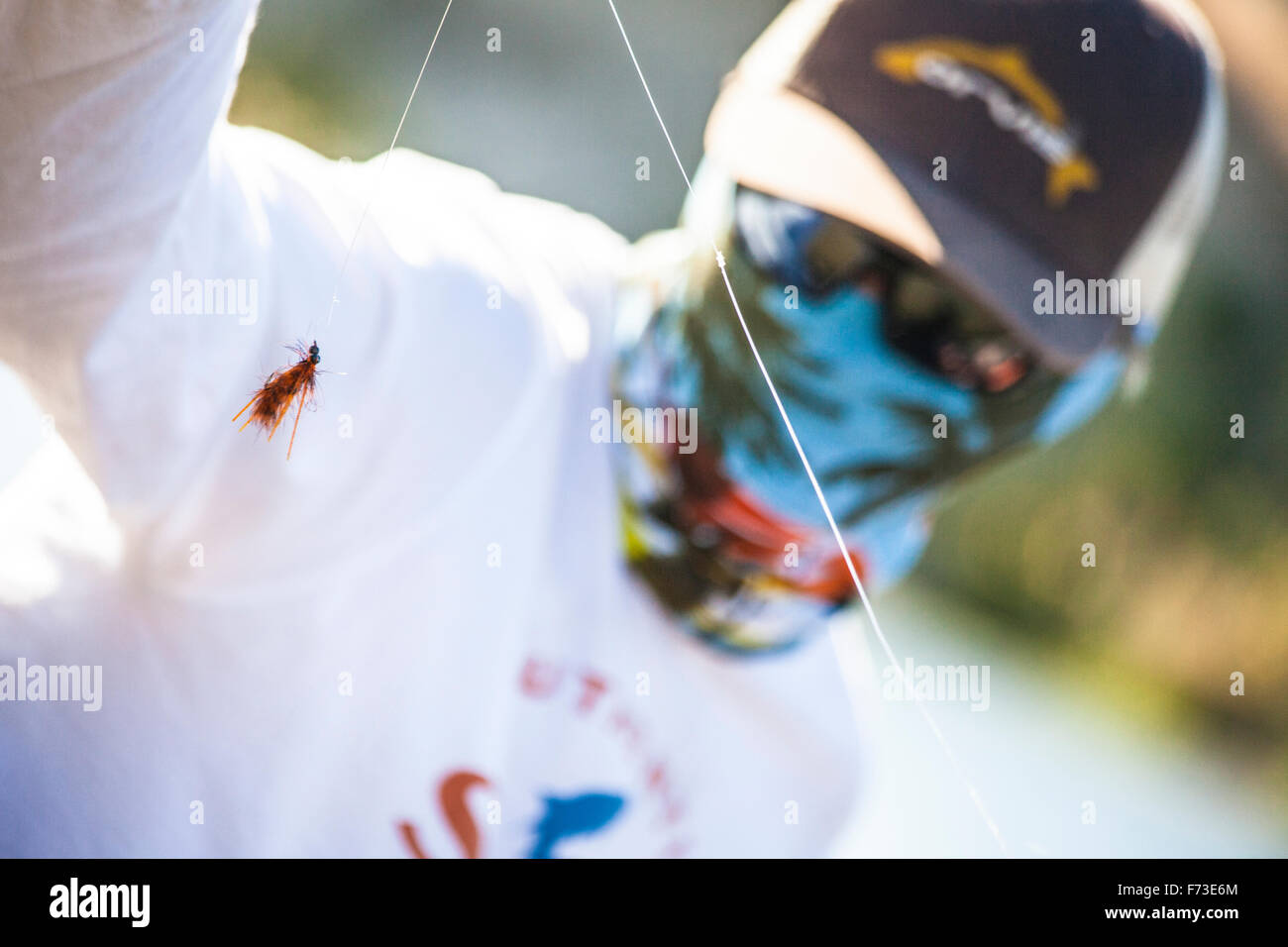 A fly fisherman shows off his fly Stock Photo - Alamy
