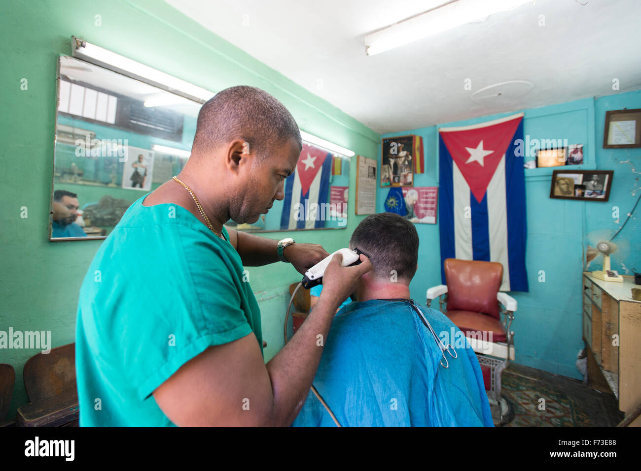 A man gets a haircut at a barbershop in Havana, Cuba Stock Photo - Alamy