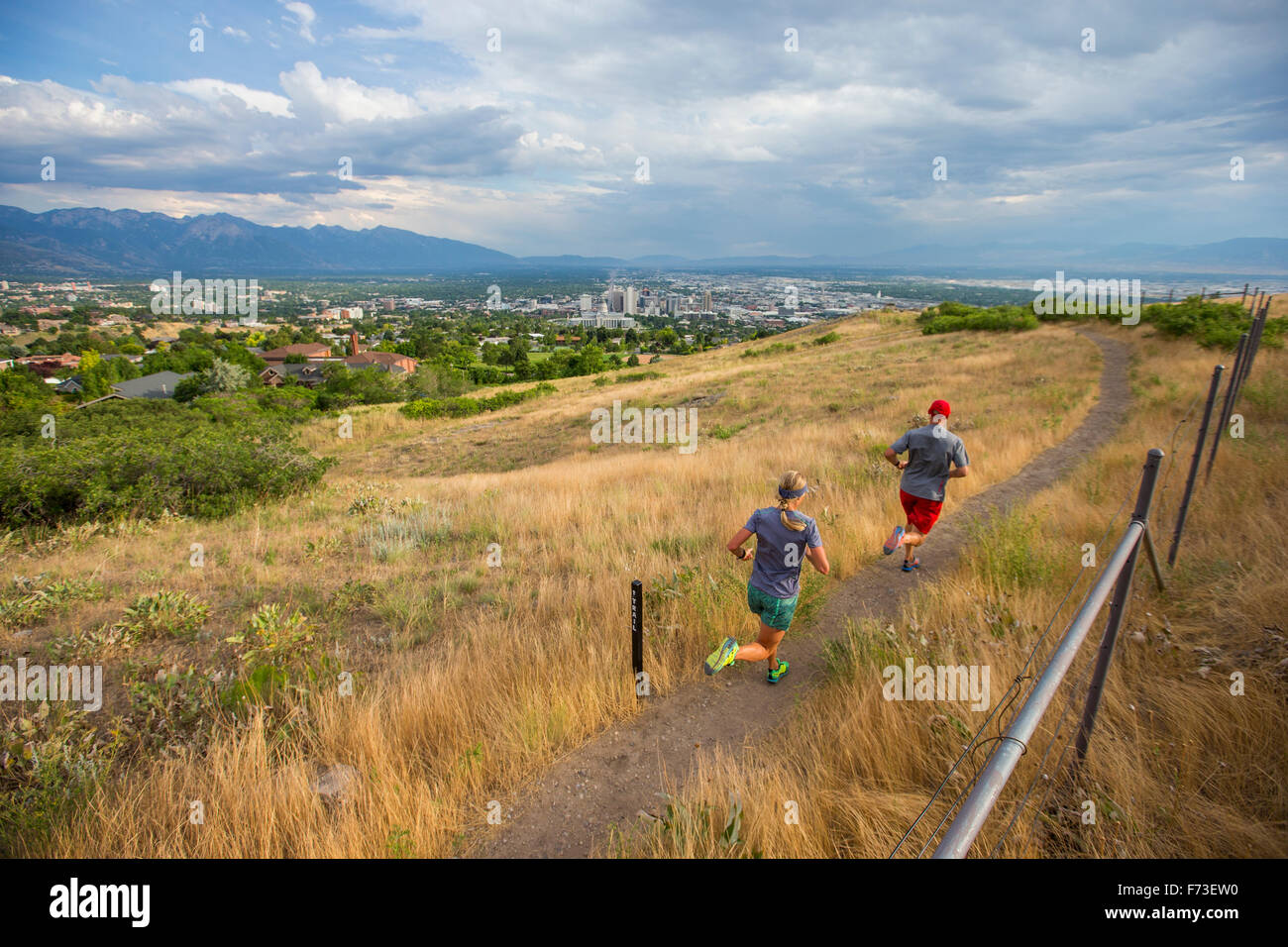 Young couple running on a mountain path hi-res stock photography and ...