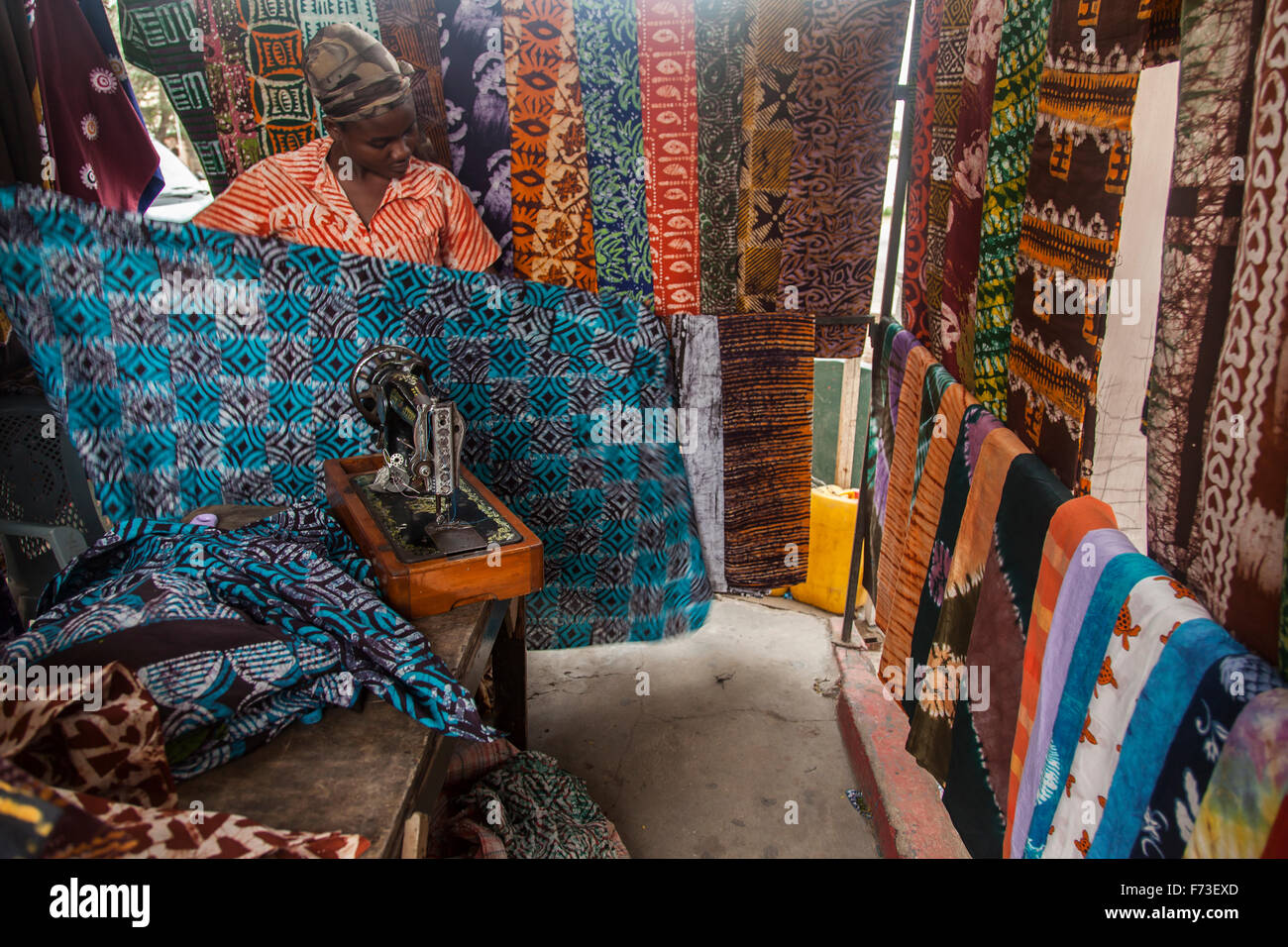 Woman selling fabric Stock Photo - Alamy