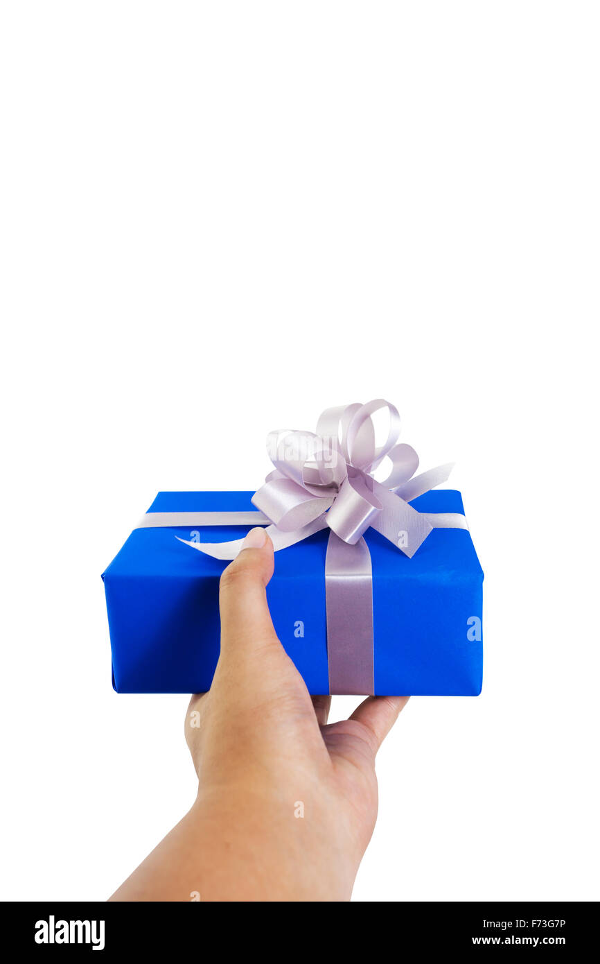 Asian hand gesture giving a gift wrapped in blue box with silver ribbon ...