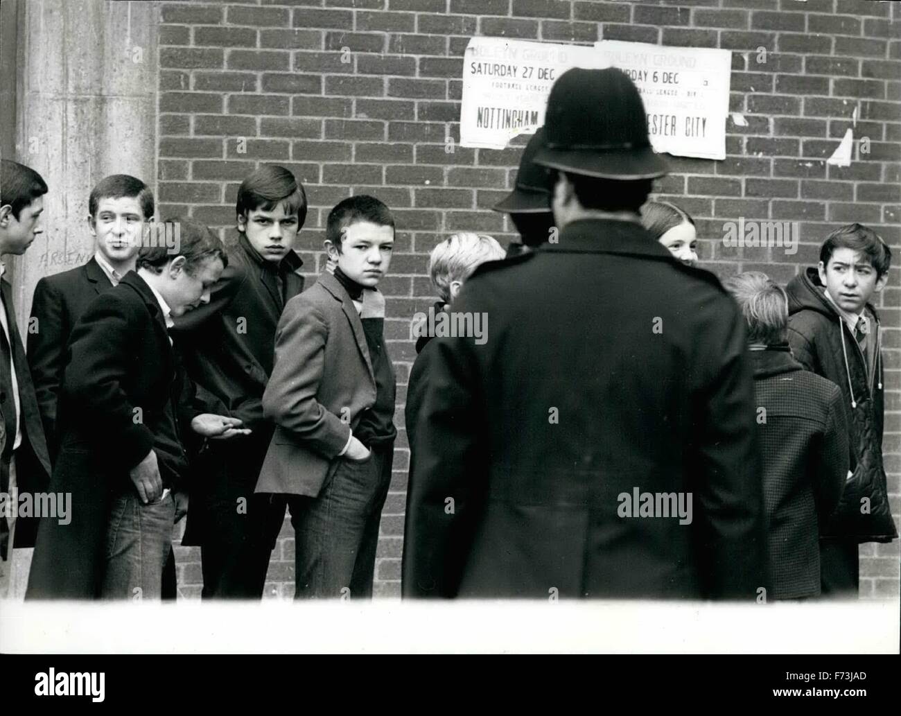 1968 - A Policeman stands by as some skinheads join a queue for tickets ...