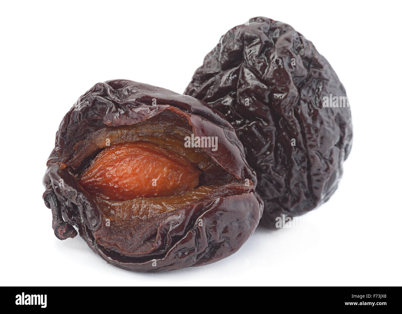 Open dry smoked plum isolated on white bckground Stock Photo - Alamy