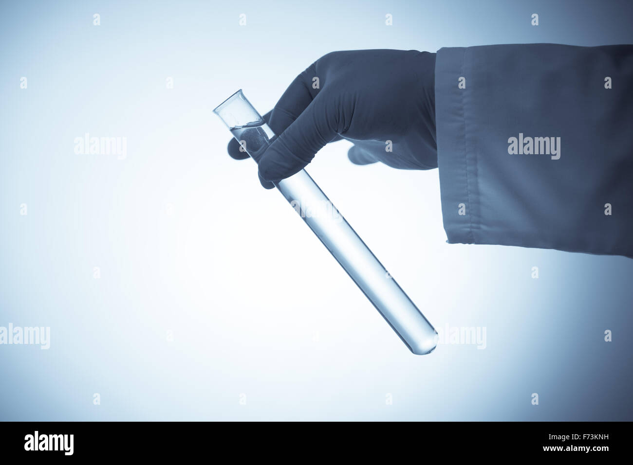 Tube in hand Stock Photo - Alamy