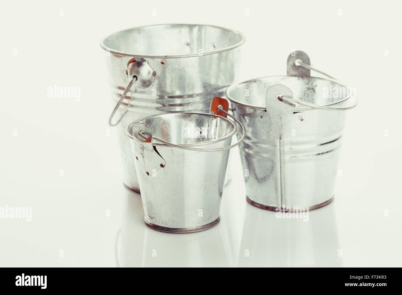 Three metal buckets Stock Photo - Alamy