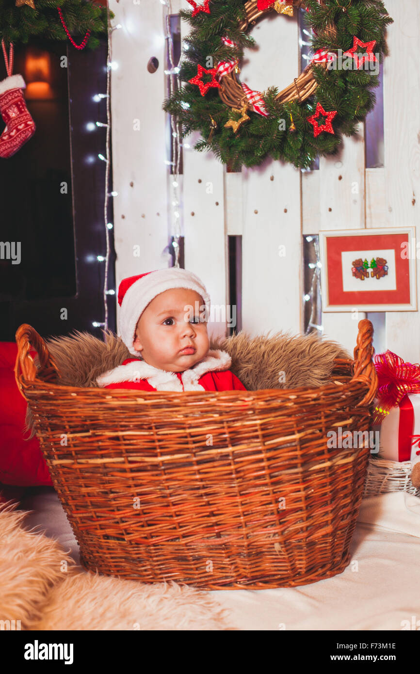 Baby in Santa costume Stock Photo - Alamy