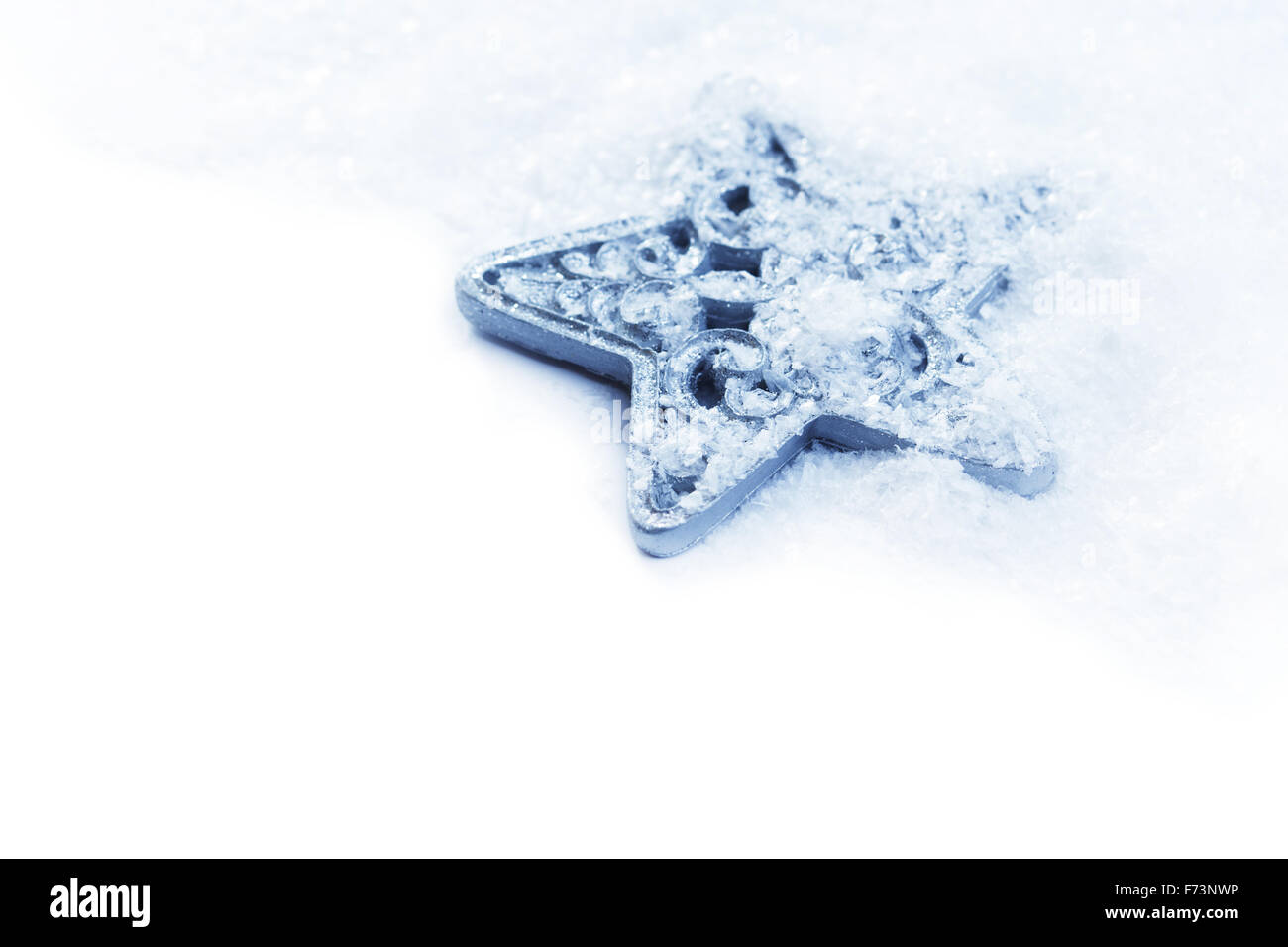 star snowflake christmas decoration in white snow isolated Stock Photo ...