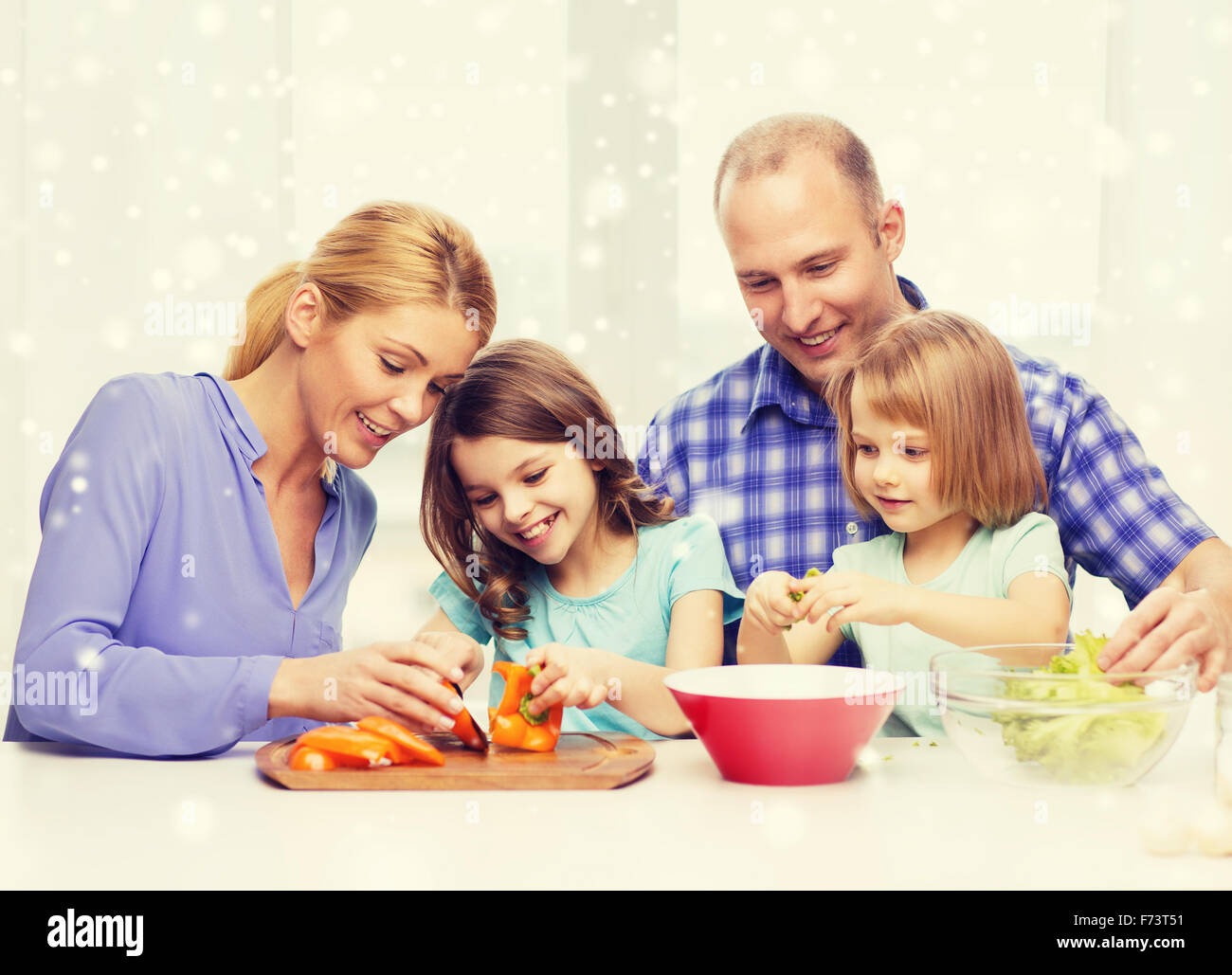happy family with two kids making dinner at home Stock Photo - Alamy