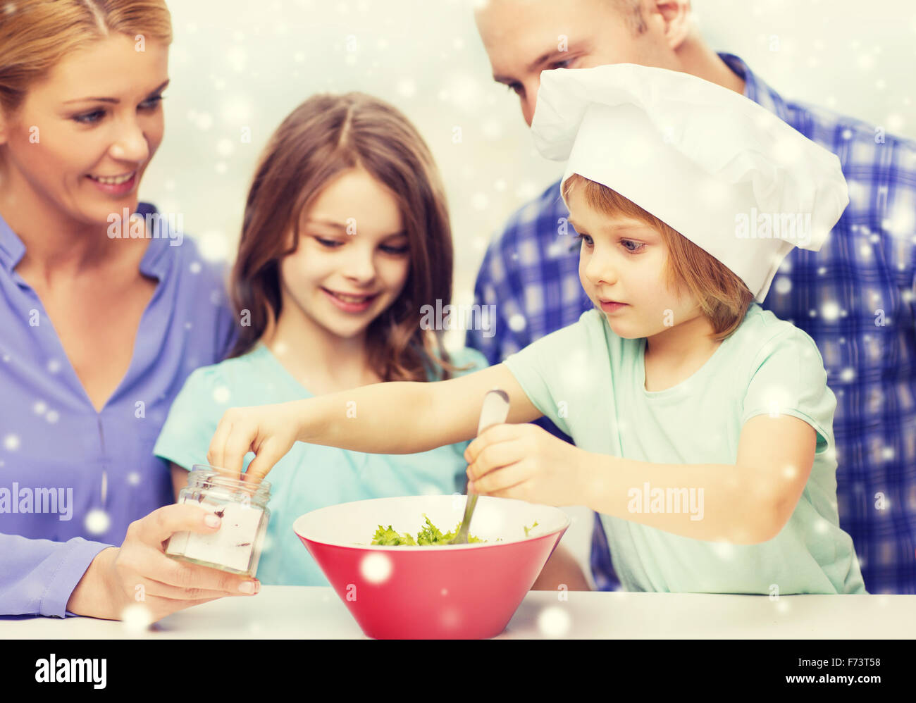 happy family with two kids making salad at home Stock Photo - Alamy