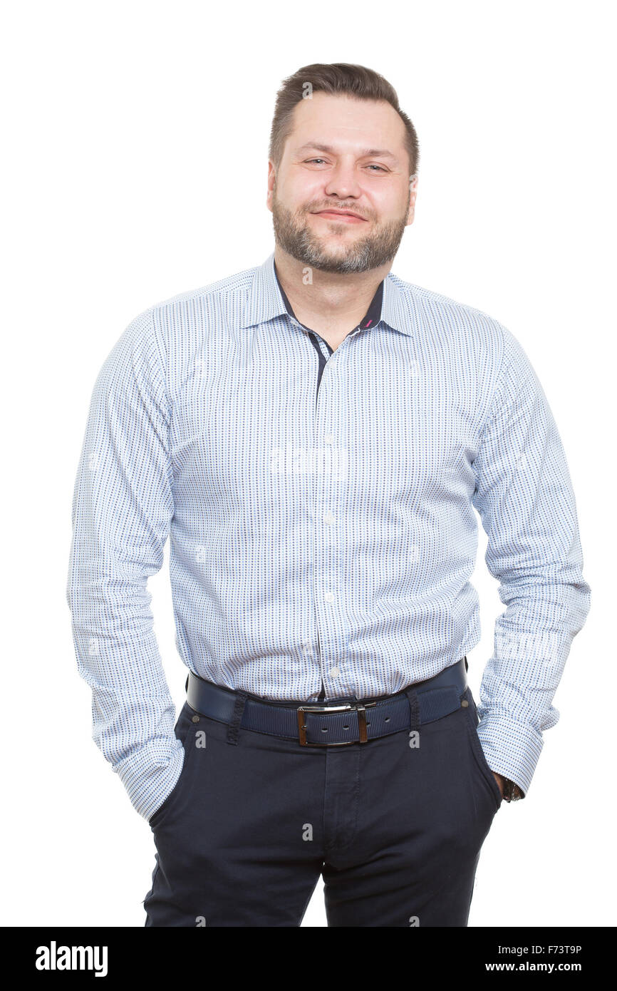 male with a beard. isolated white background. hands in his pockets ...