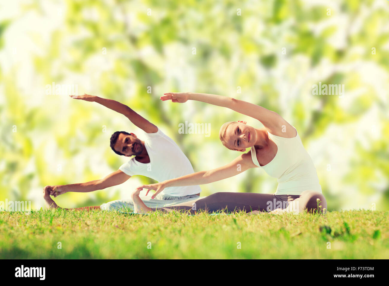 Beautiful couple doing yoga hi-res stock photography and images - Alamy