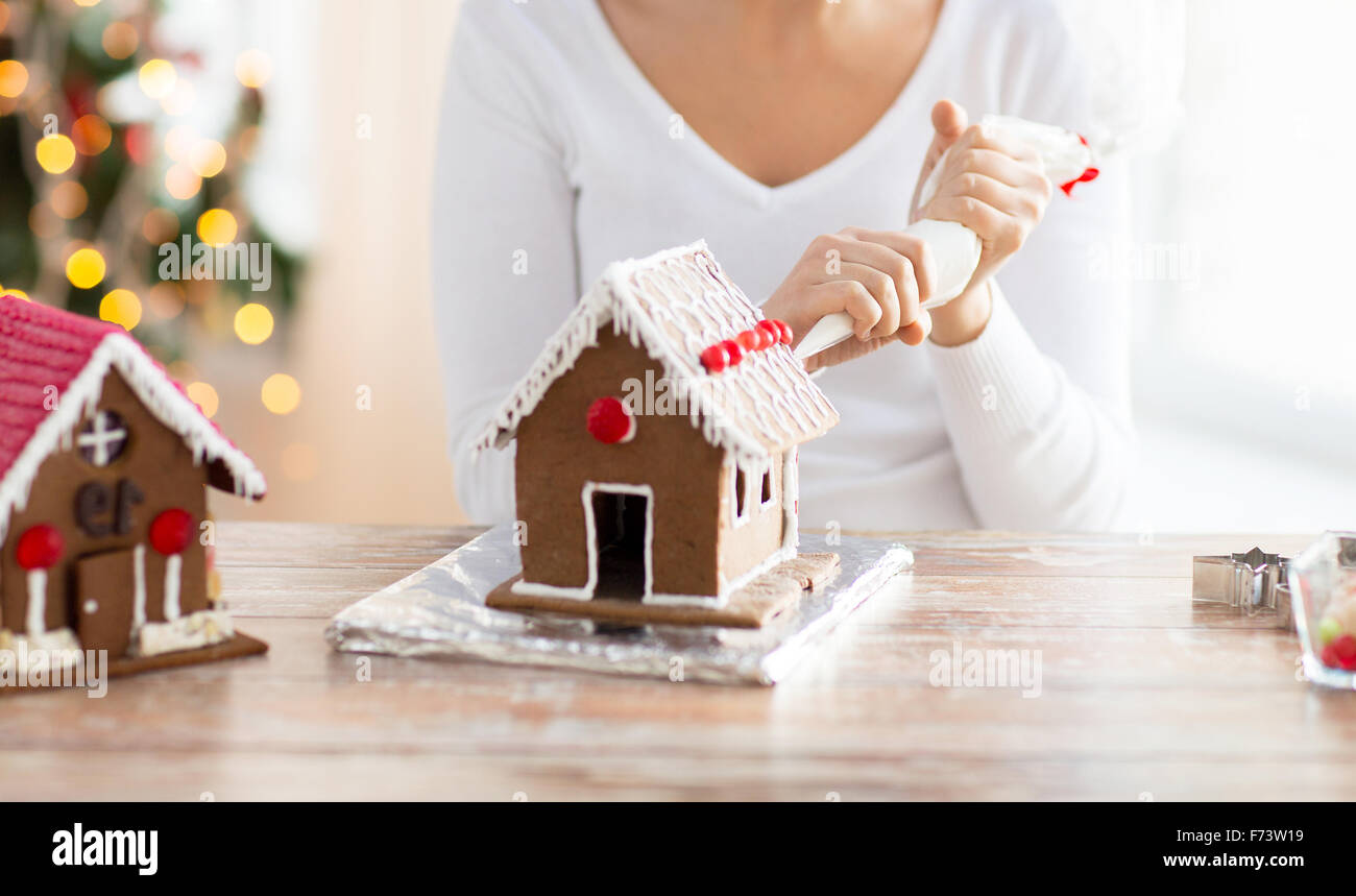 close up of woman making gingerbread houses Stock Photo - Alamy